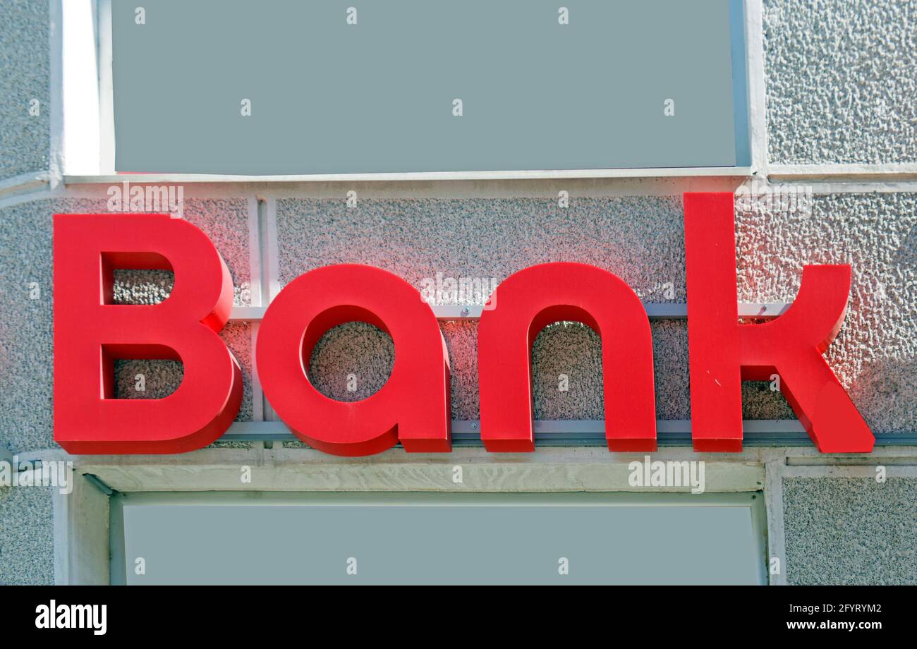 Bank signage attached to building facade in urban city Stock Photo - Alamy