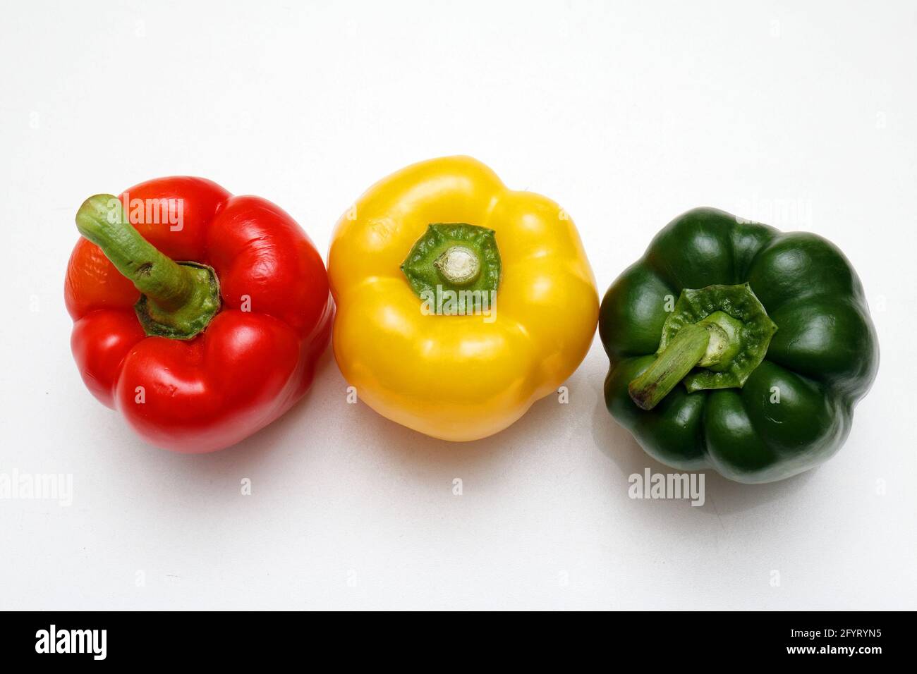 Colorful raw organic peppers vegetables isolated on white background ...