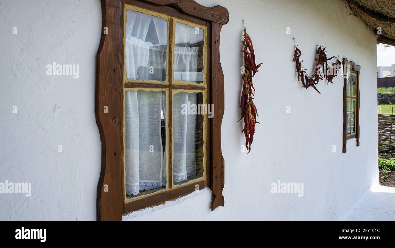 Rural house with wooden window and peppers Stock Photo - Alamy