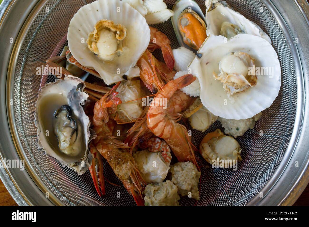 Steamed seafood over hot spring vents in Beppu, Japan Stock Photo - Alamy