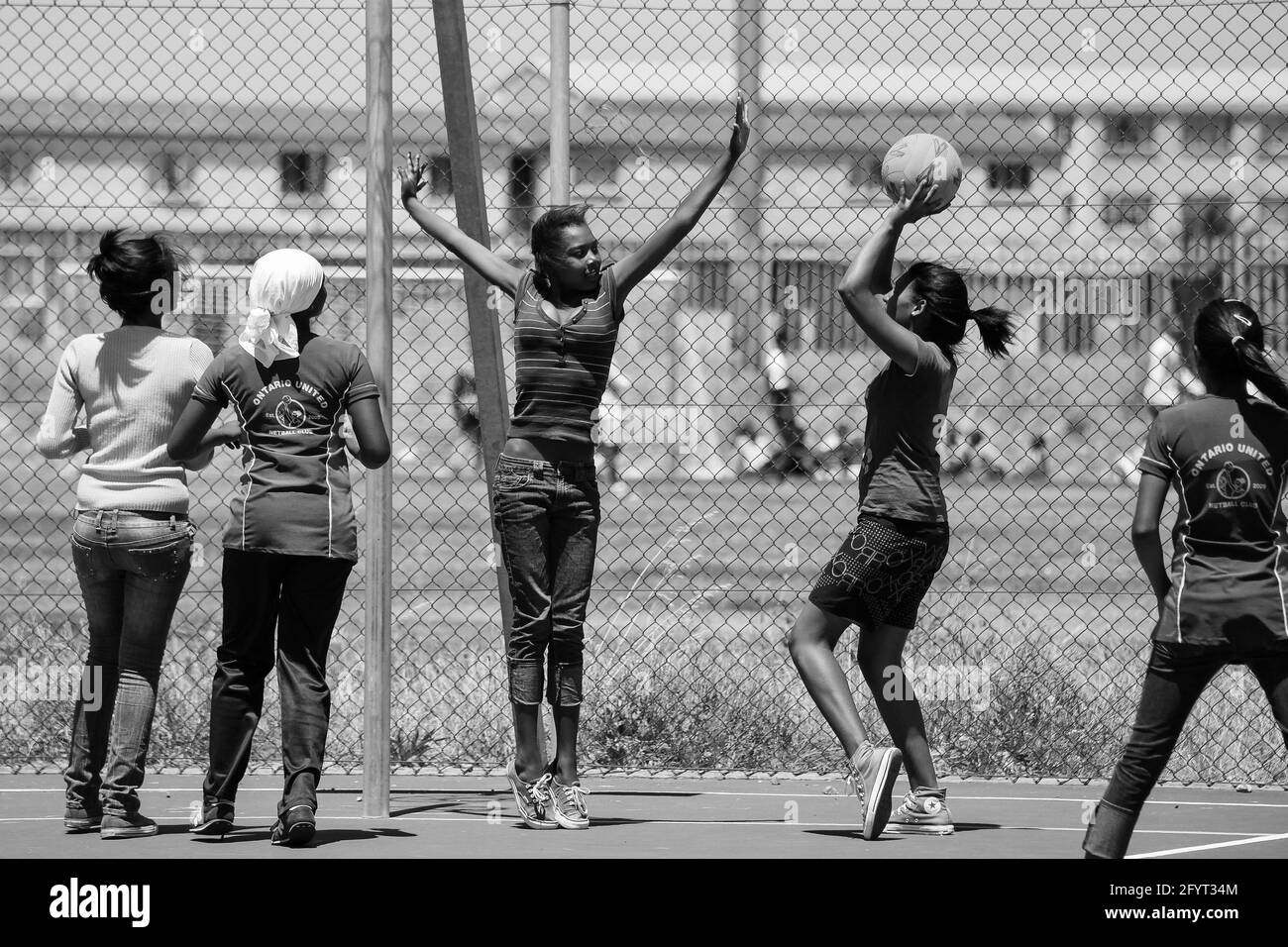 Girl playing netball Black and White Stock Photos & Images - Alamy