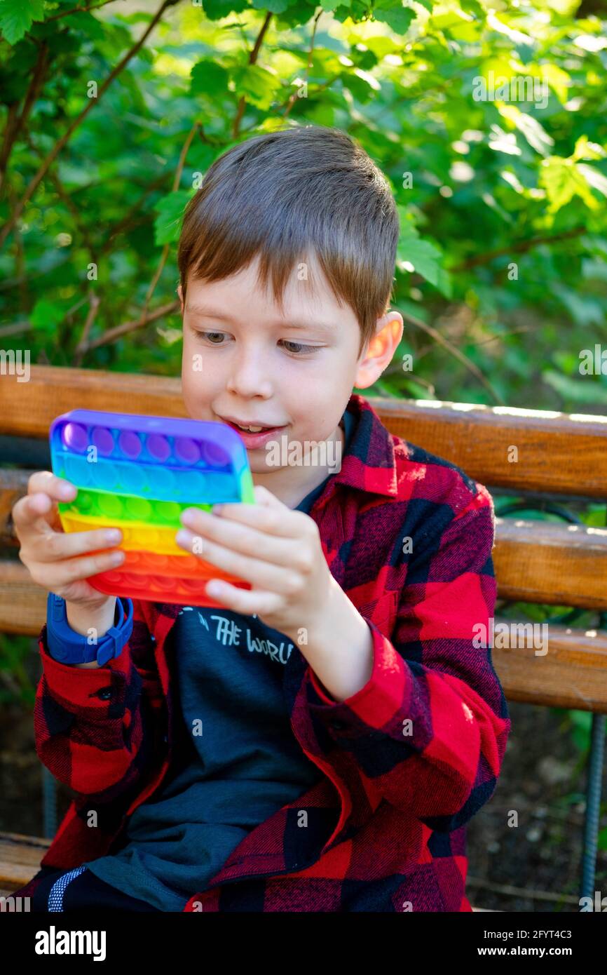 Child playing pop it toy hi-res stock photography and images - Alamy