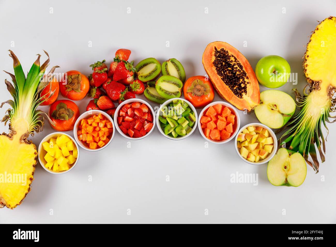 Rainbow from exotic and tropical fruits papaya, pineapple, kiwi, apple ...