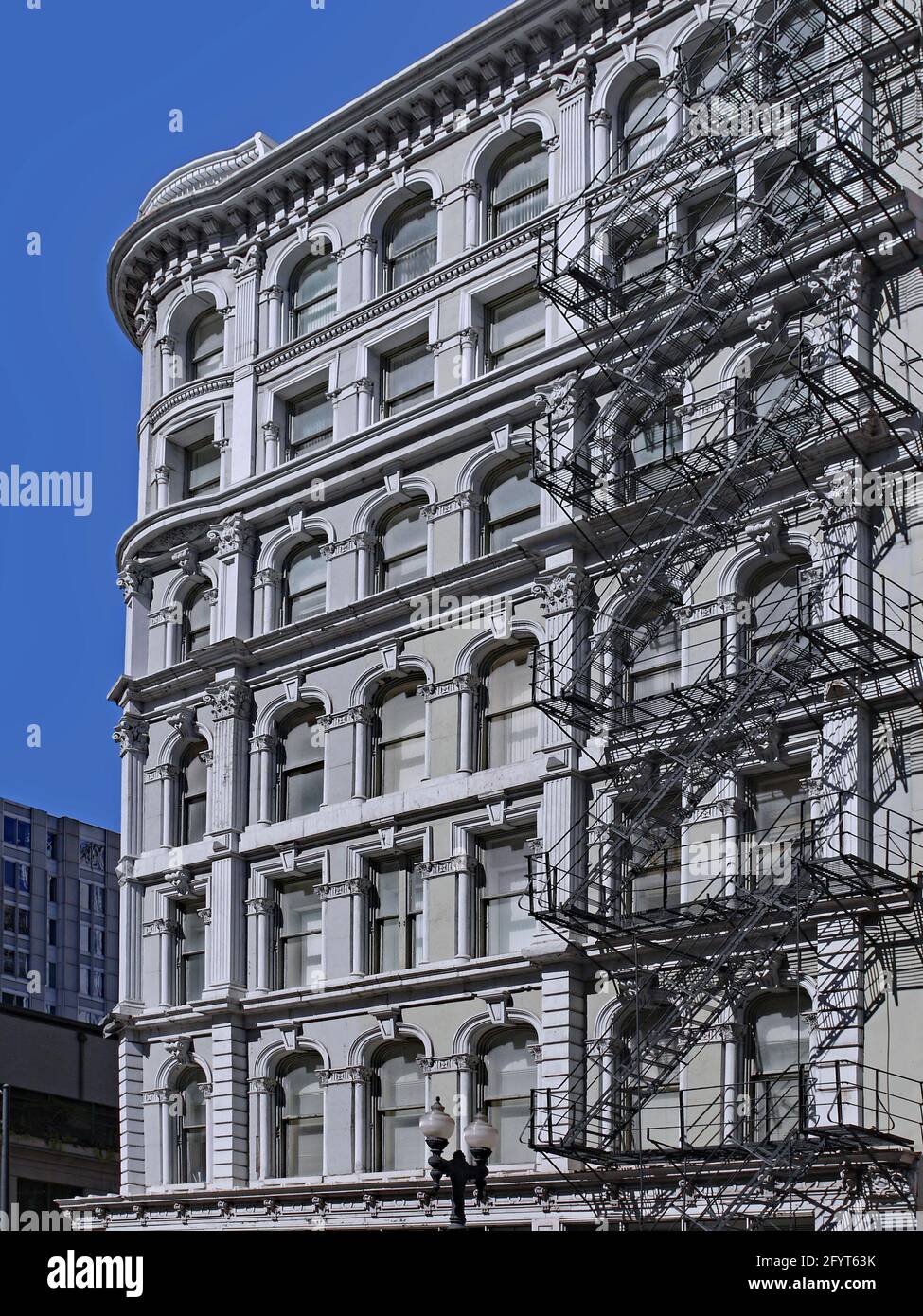 vintage office building or apartment building with external fire escape ...