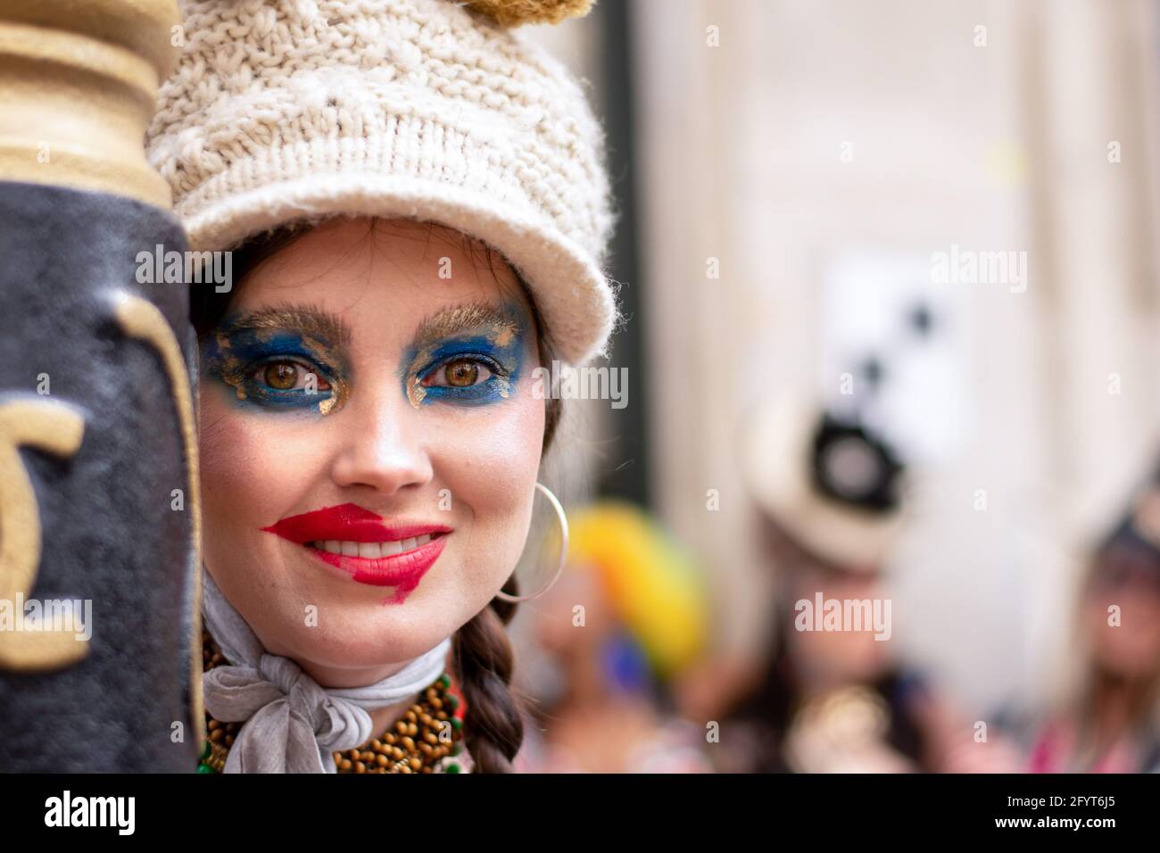 A model showcases Pierre Garroudi's latest colourful collection at one ...