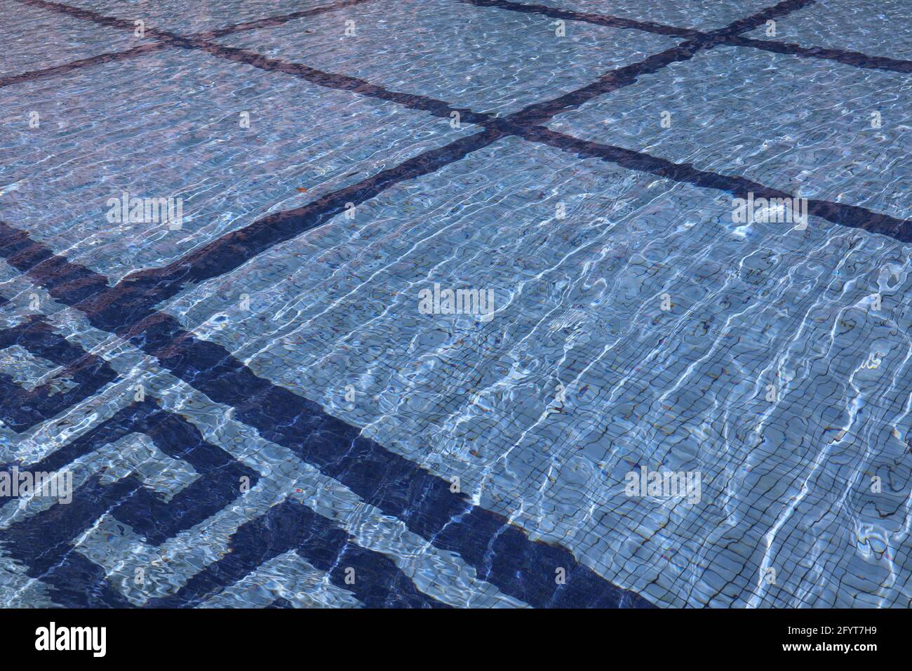 A closeup of refreshing pool with tile design at a luxury resort Stock ...