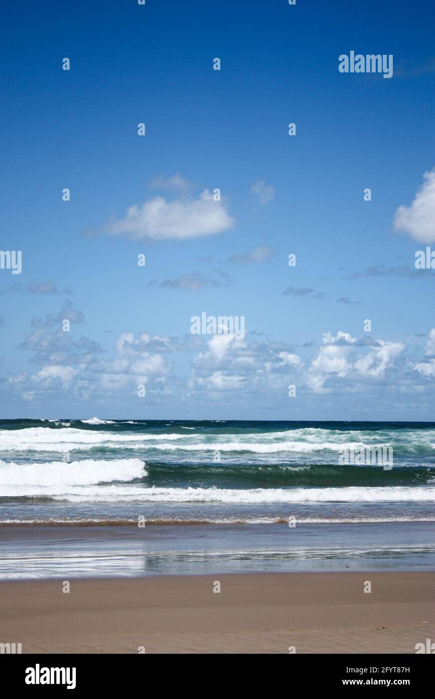 The ocean waves on the sandy beach Stock Photo - Alamy