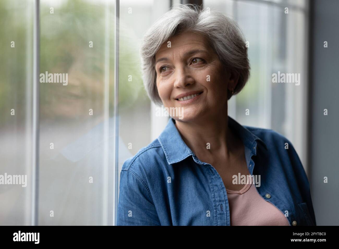 Middle aged attractive woman looks hi-res stock photography and images ...
