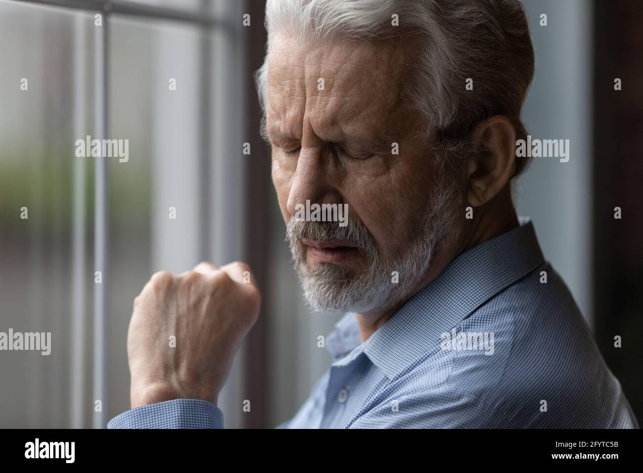 Closeup sad older man face standing indoor with eyes closed Stock Photo ...