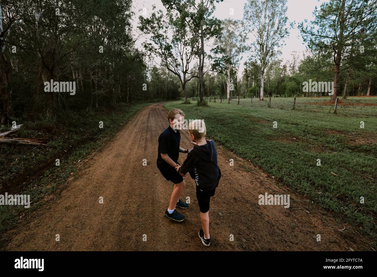 Two boys walking on trail hi-res stock photography and images - Alamy