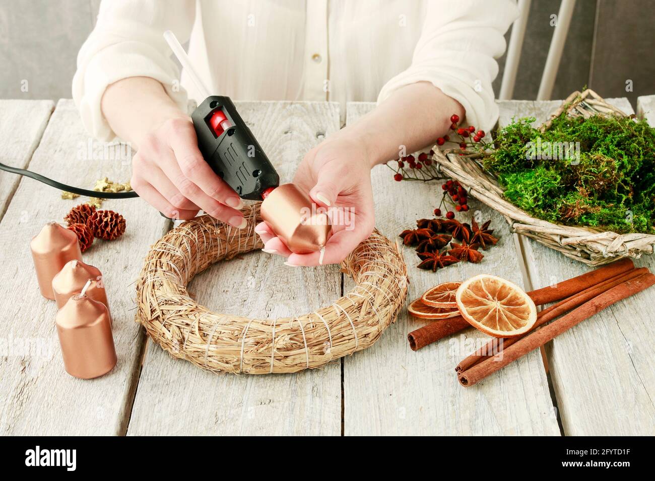 Florist at work: How to make advent table wreath, step by step Stock Photo - Alamy
