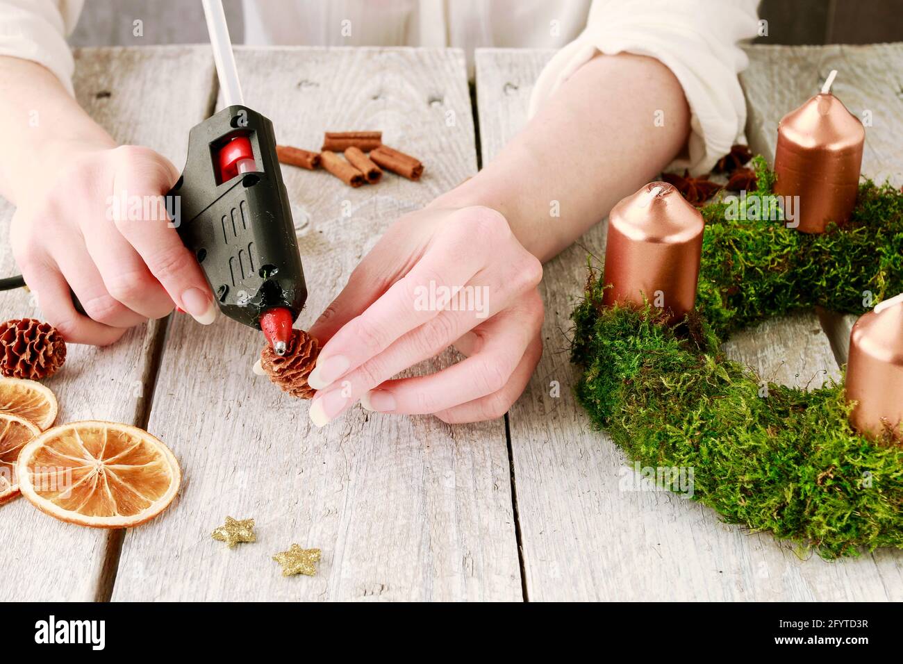 Florist at work: How to make advent table wreath, step by step Stock Photo - Alamy