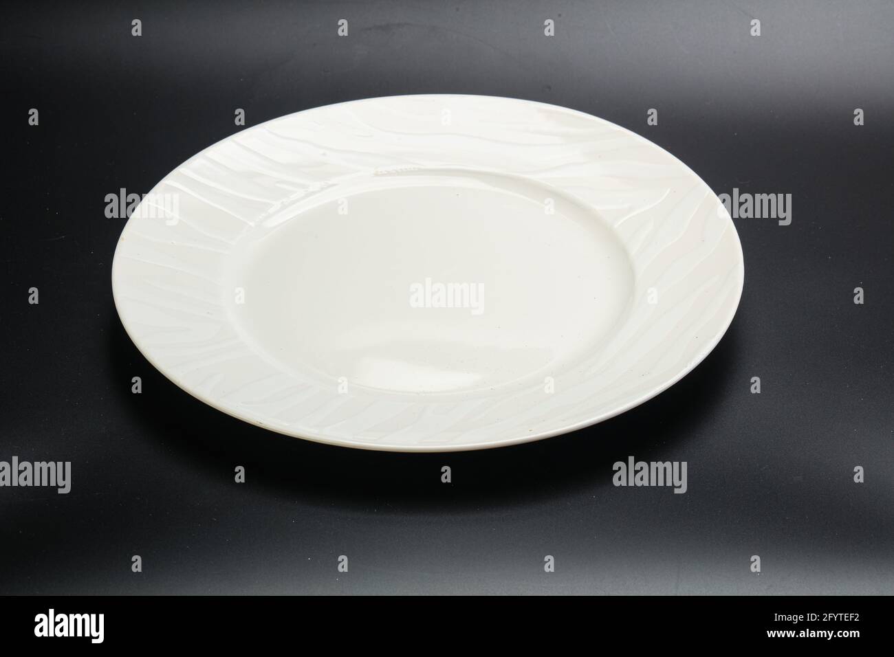 White empty plate for serving isolated Stock Photo - Alamy