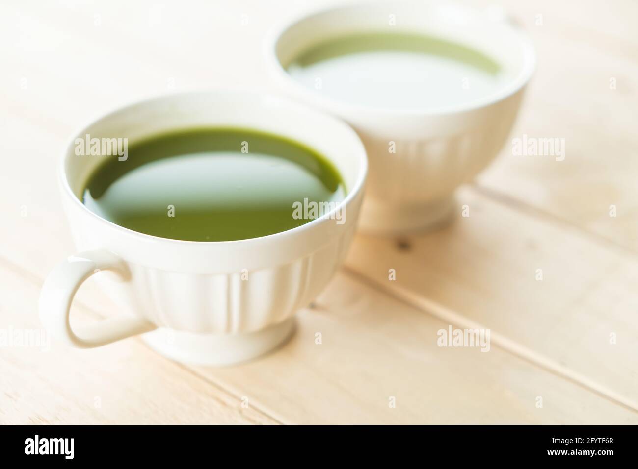 hot matcha latte on wood Stock Photo - Alamy