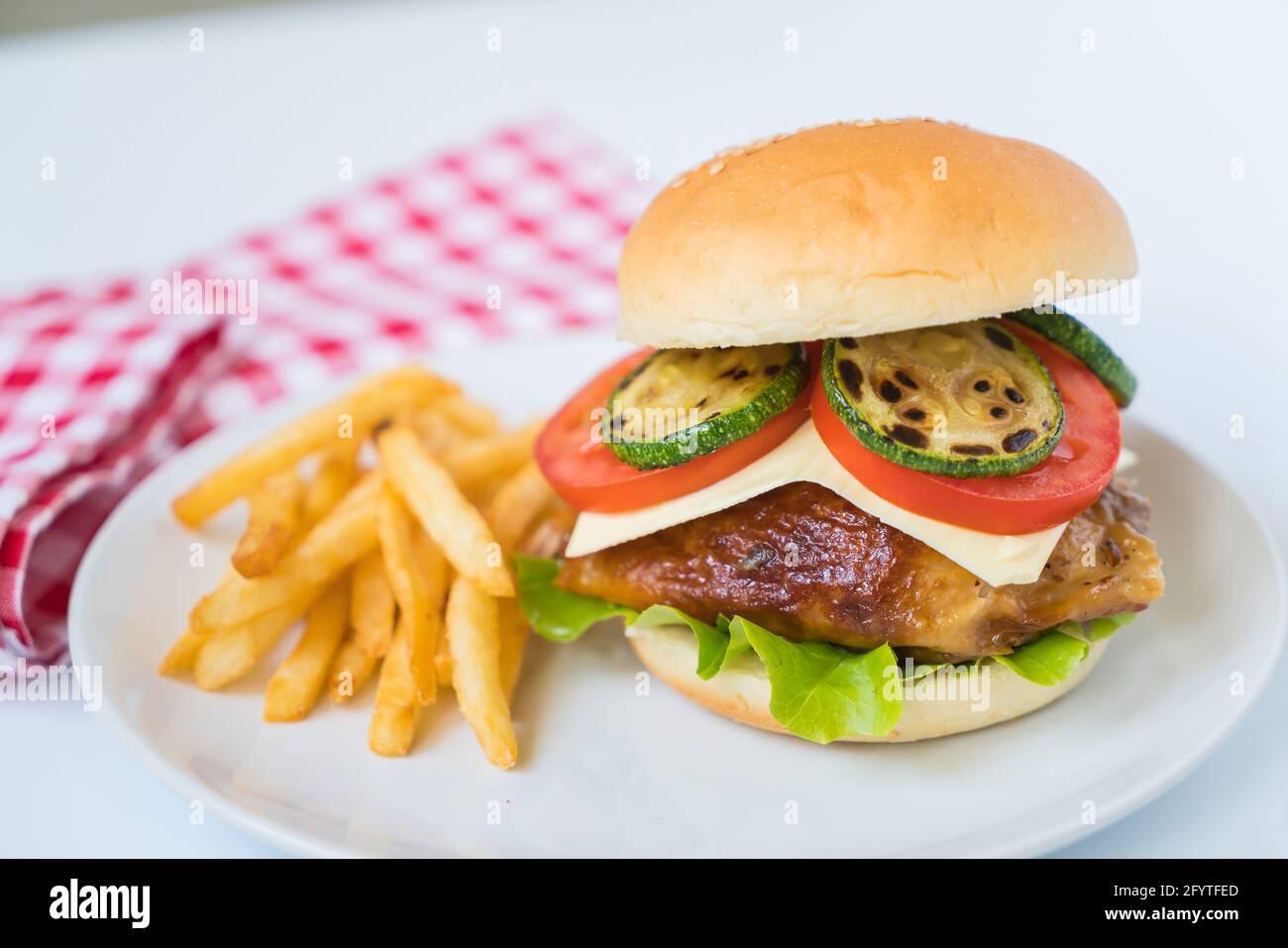 grill chicken burger with french fries Stock Photo - Alamy