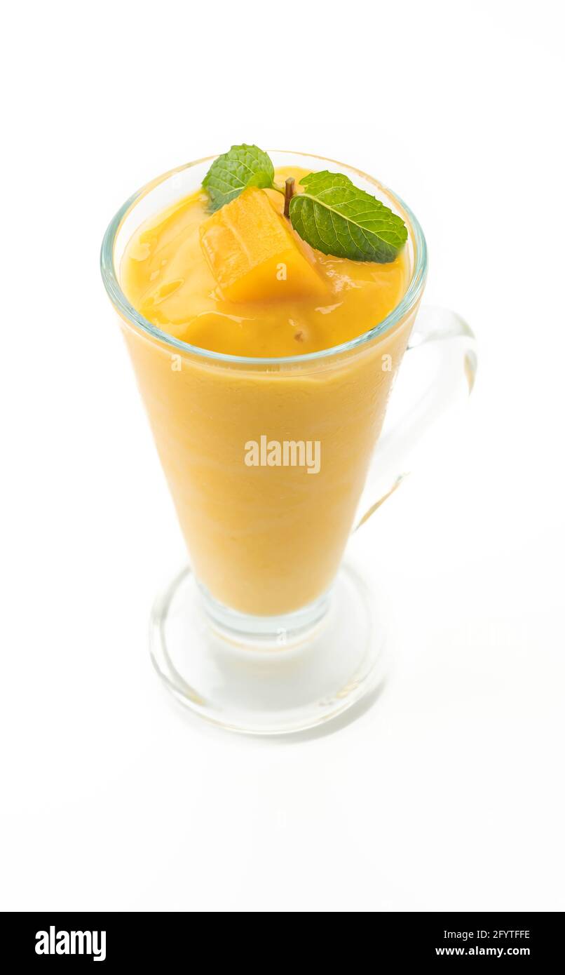 fresh mango smoothie on white background Stock Photo - Alamy