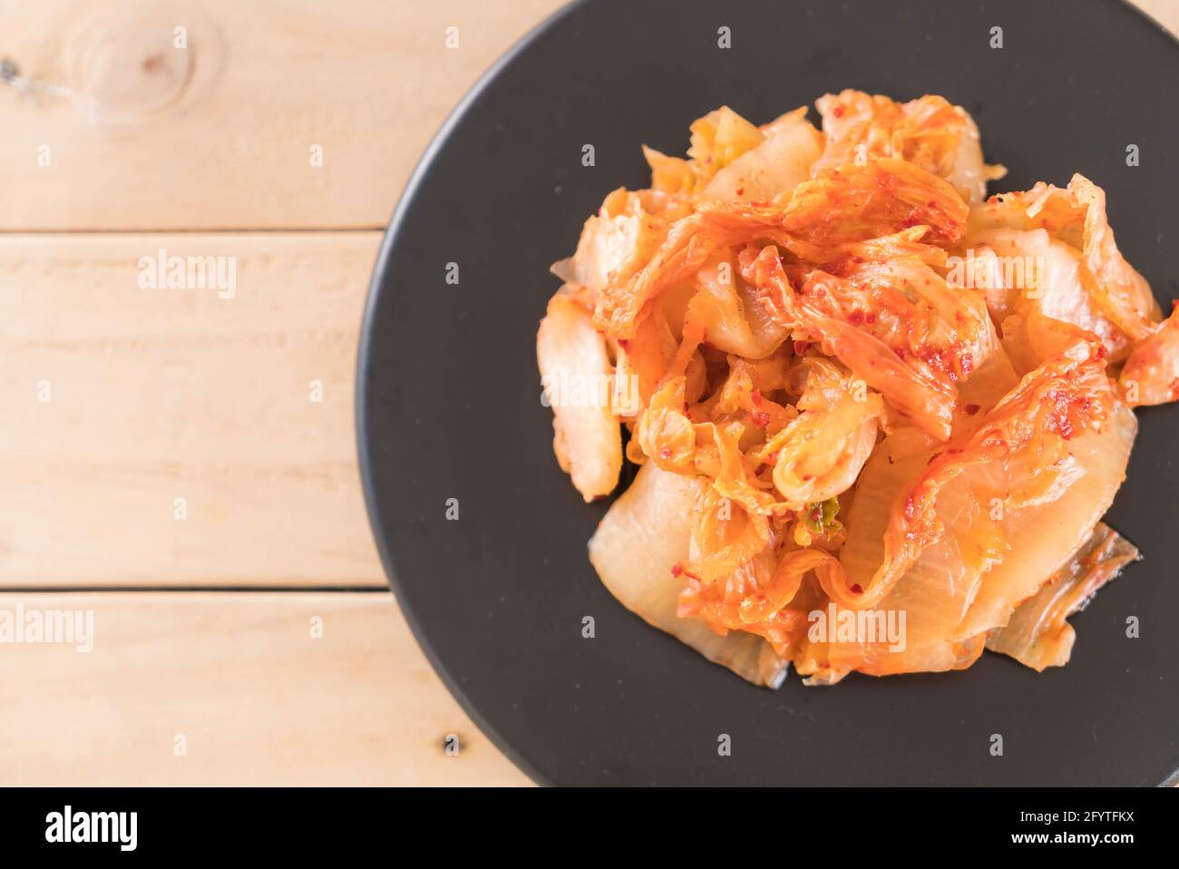 kimchi on wood background - korean food Stock Photo - Alamy