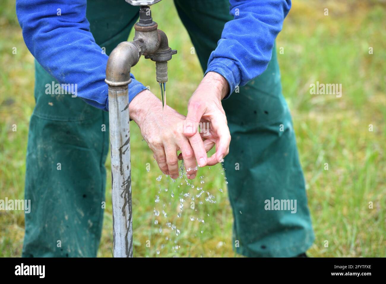 Supply of water from a well through a water pipe and a tap in the ...
