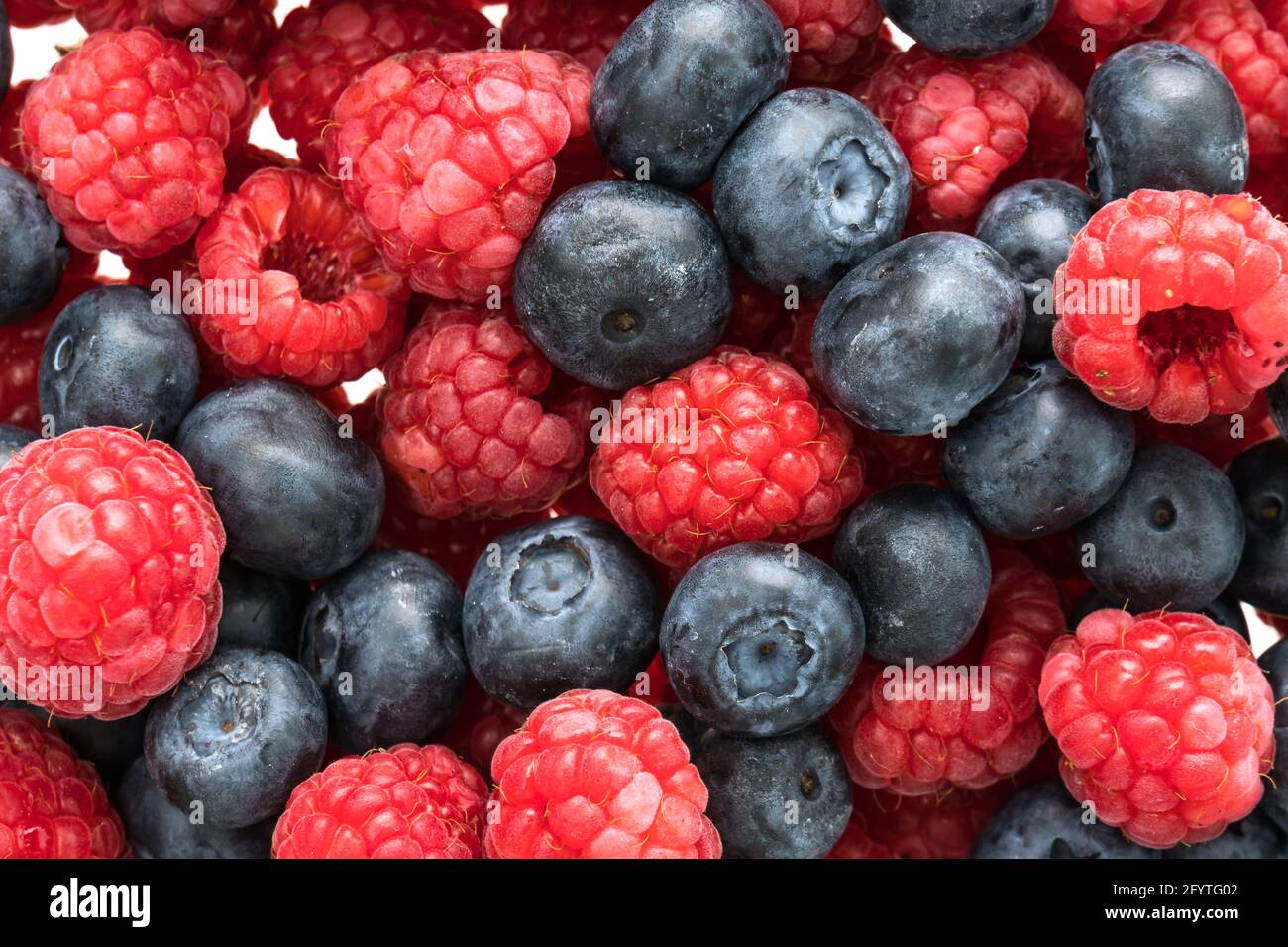Group of Blueberry and Rasberry fruit isolated on white background ...
