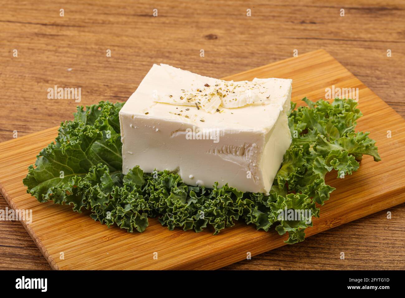 Traditional tasty Greek Feta soft cheese brick Stock Photo - Alamy