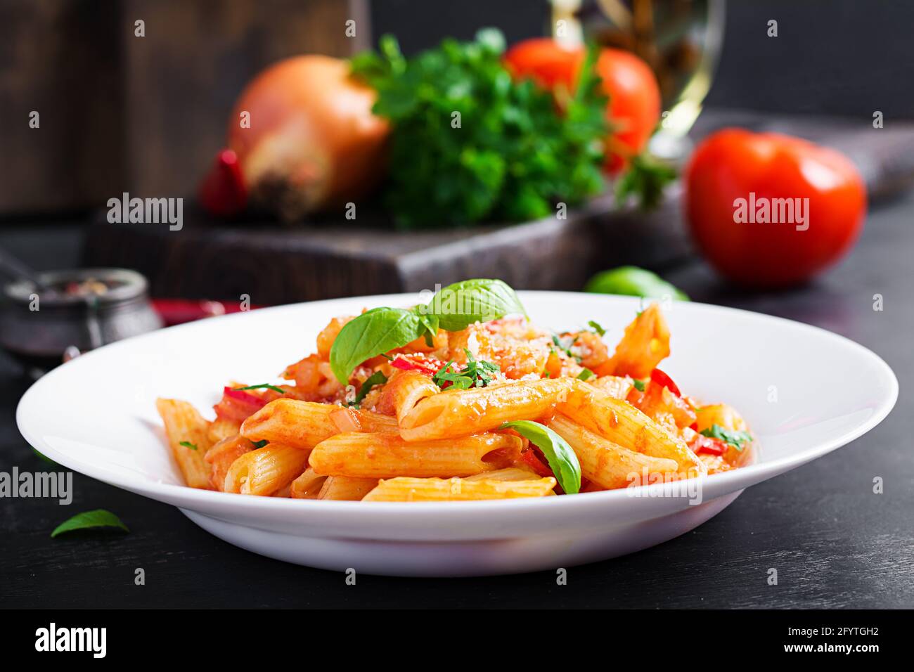 Classic italian pasta penne alla arrabiata with basil and freshly ...