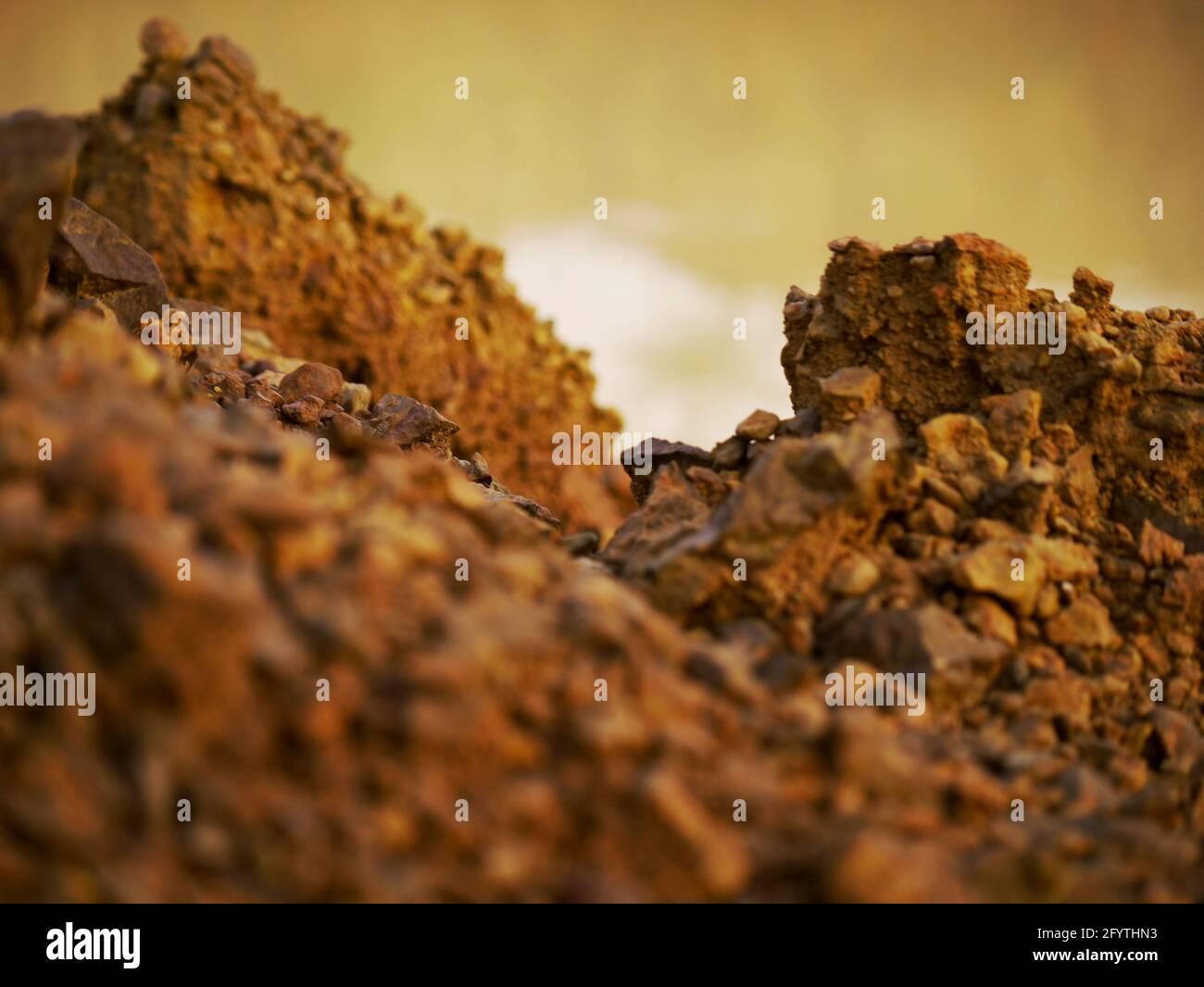 Brown stone rocks texture behind dirty water river presented on ...
