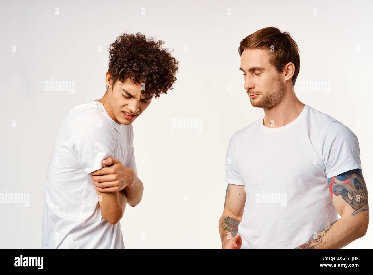 Two young friends wearing t shirts hi-res stock photography and images - Alamy