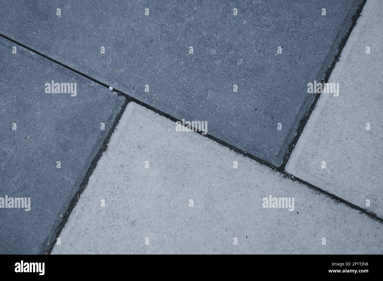 A high angle shot of two different colors of tiles on a surface Stock ...