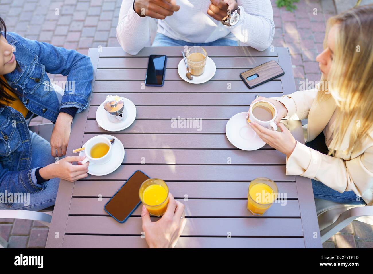Diverse group drinking tea hi-res stock photography and images - Alamy