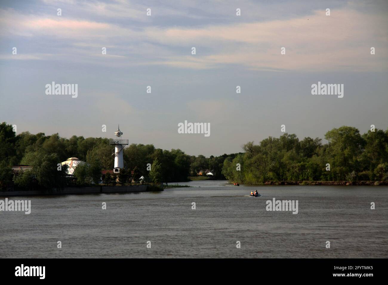 Transportation concept. cityscape - white lighthouse on a river Stock ...