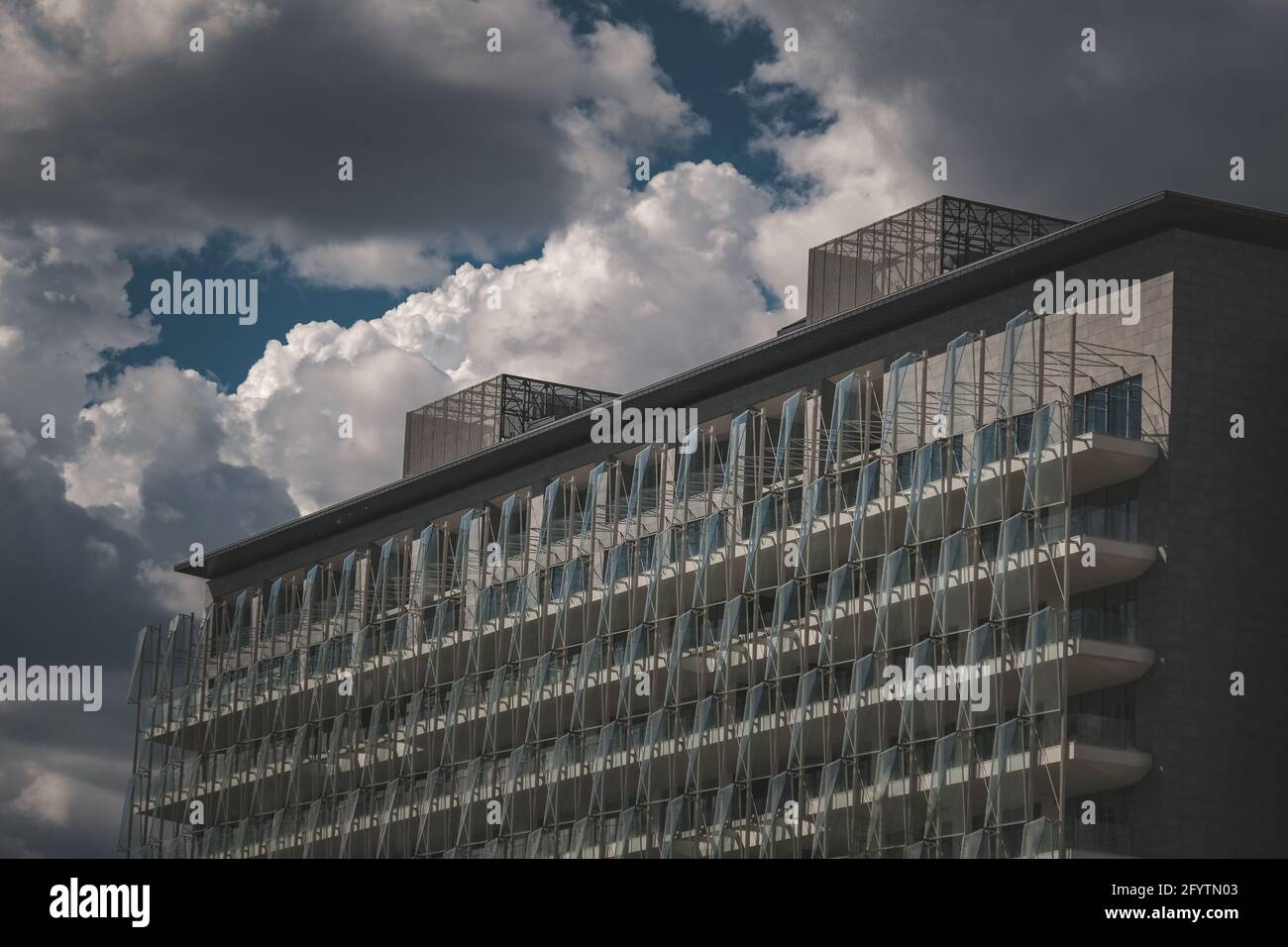 A low angle shot of a modern building with the external wall in ...