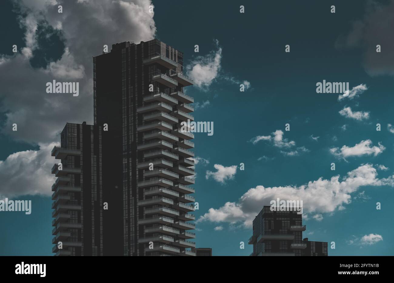 A low angle shot of tal buildings with designed balconies and beautiful ...