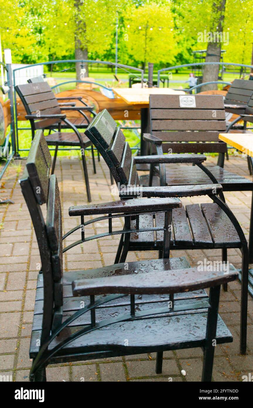 POZNAN, POLAND - May 15, 2021: Row of empty wooden chairs at a Mamma ...