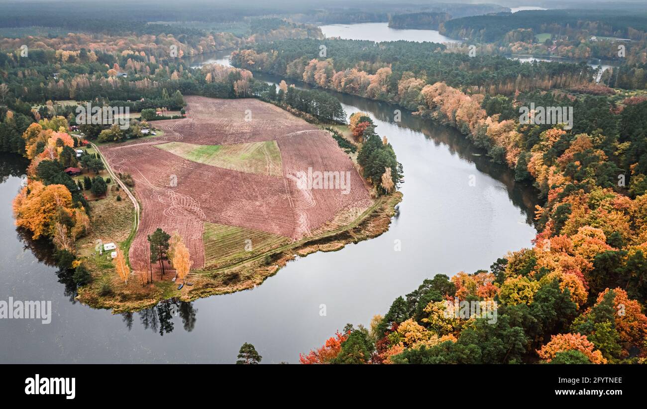 Curvy river and autumn forest. Aerial view of wildlife in Poland. Nature in Europe Stock Photo ...