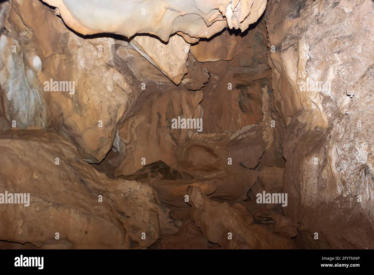 Speleology. Old cave washed by an underground river in the mountain ...