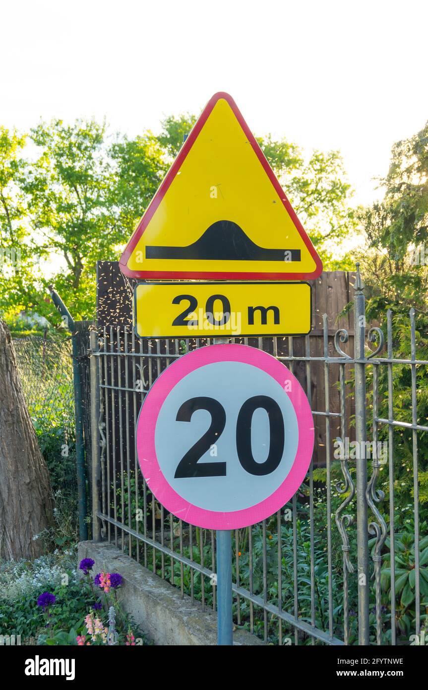 Traffic boards with speed limit of 20 by a barrier Stock Photo - Alamy