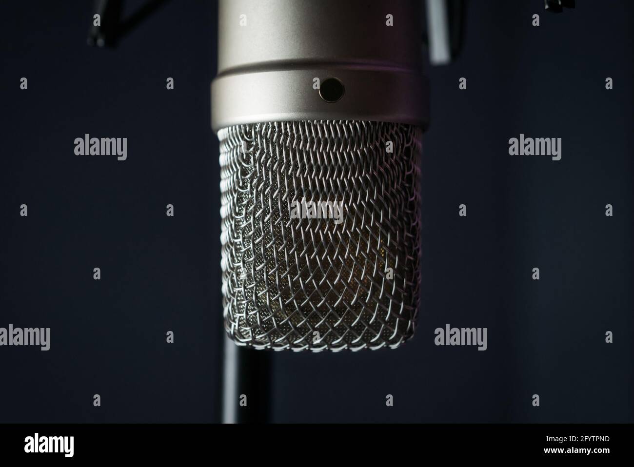 A close-up shot of a professional fixed microphone used for studio ...
