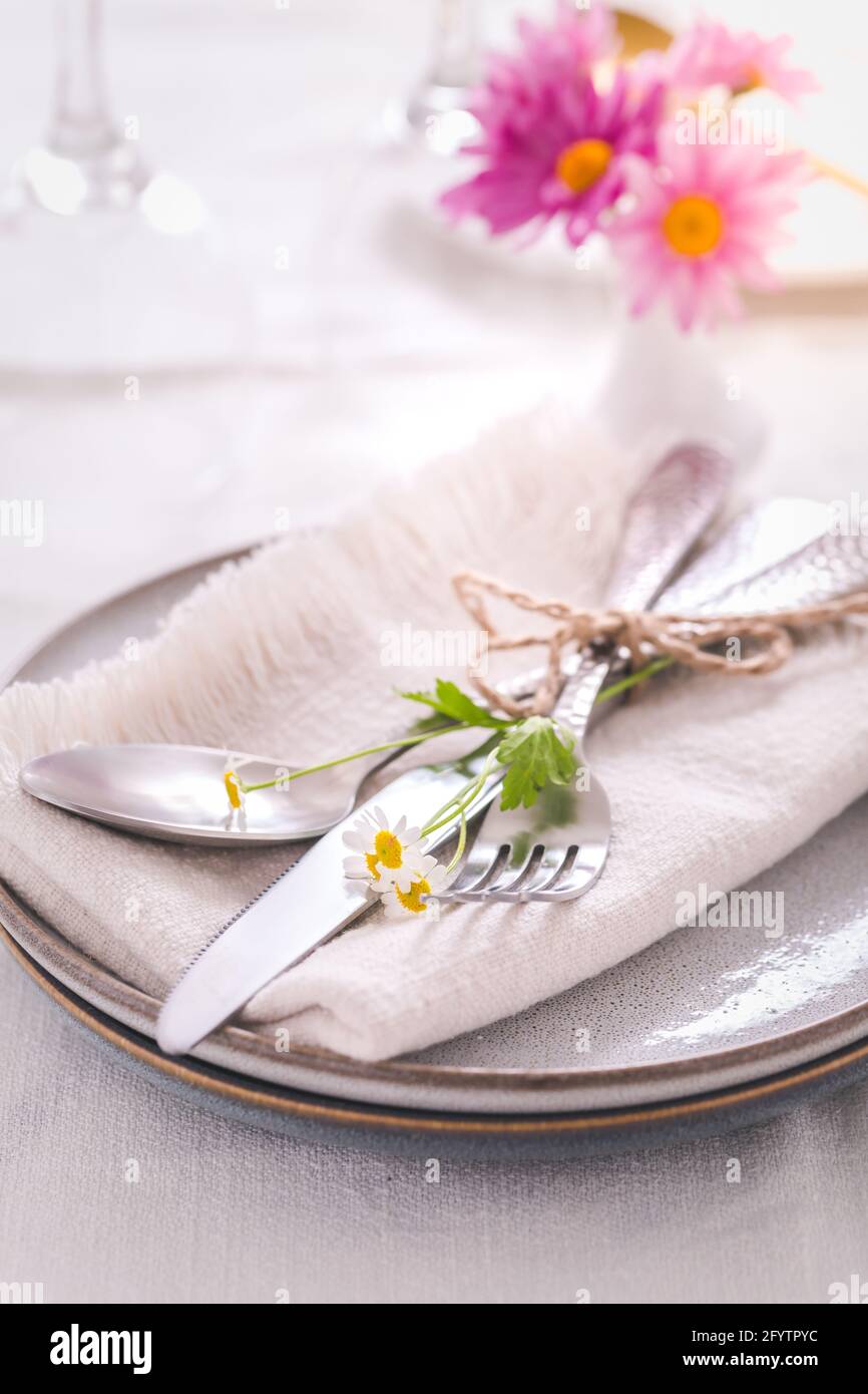 Cutlery with napkin and flower decoration - fine dining and place ...