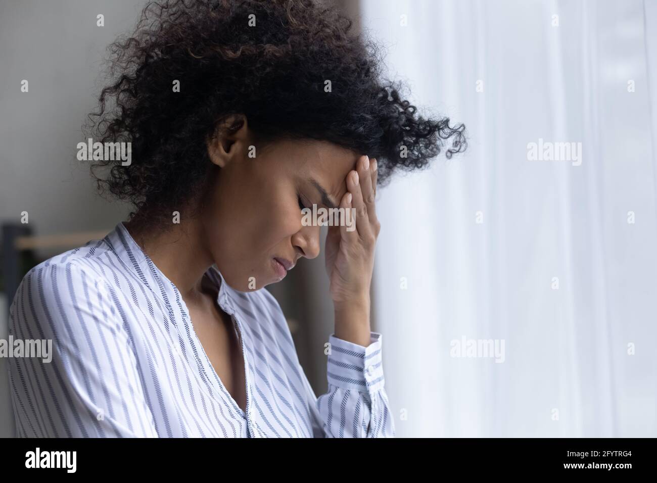 Unhappy biracial woman feel distressed with life problems Stock Photo ...