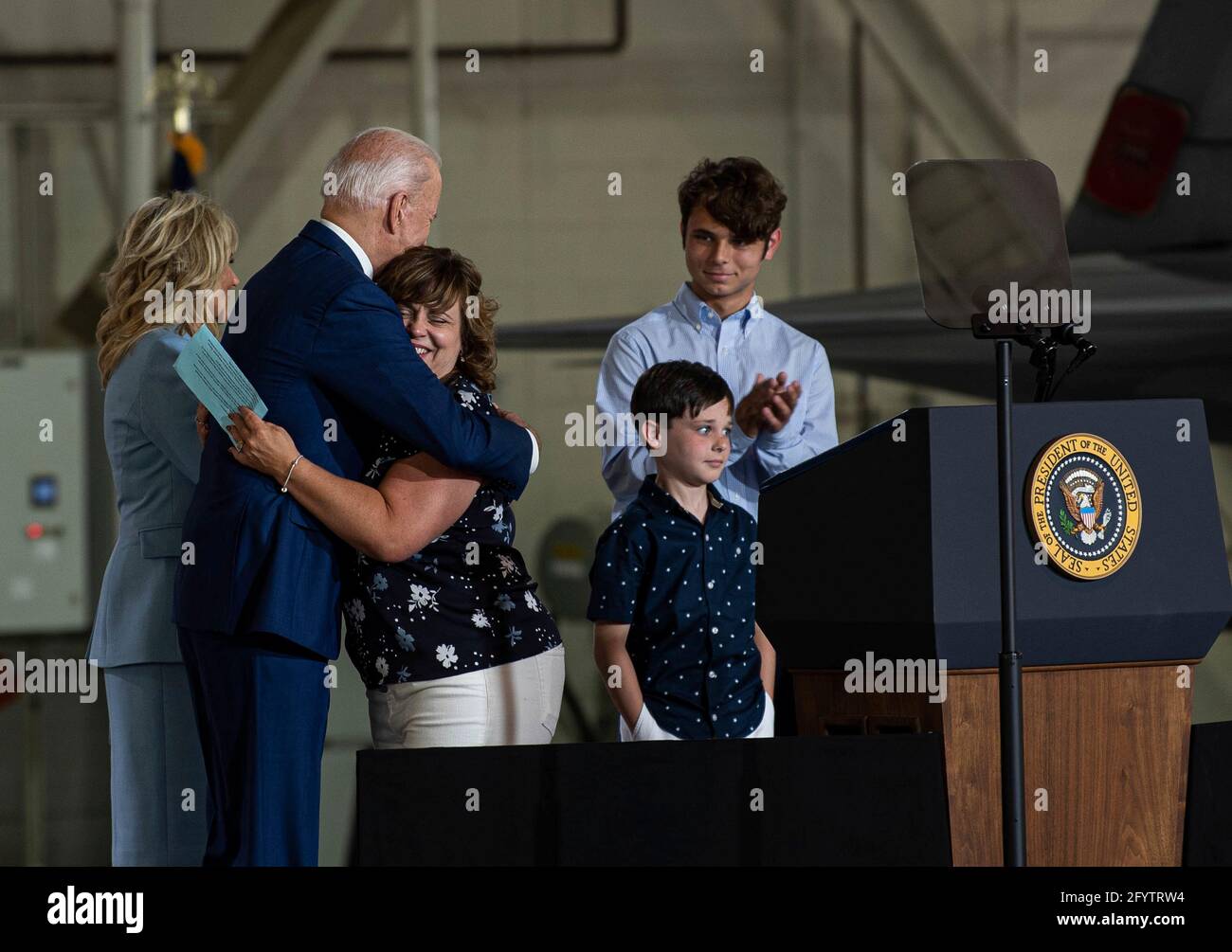 U.S. President Joe Biden embraces Brittany Bean, spouse of deployed Air ...