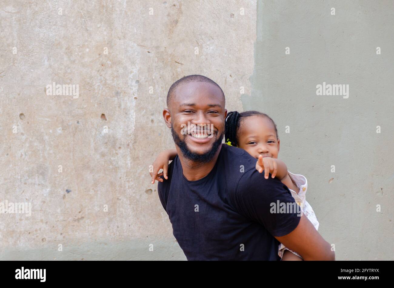 handsome african dad feeling excited as he is bonding with his daughter ...