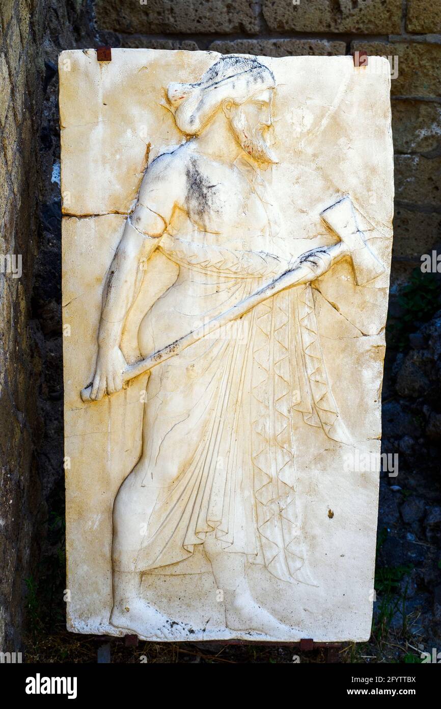 Marble relief of the god Vulcan in The Sacred Area - Herculaneum ruins ...