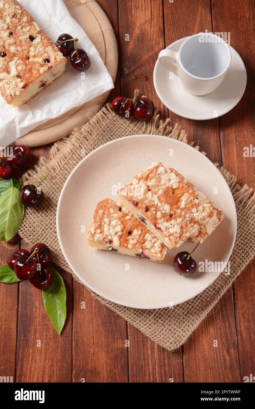 German cherry cake with vanilla and icing sugar, with glaze, served and ...