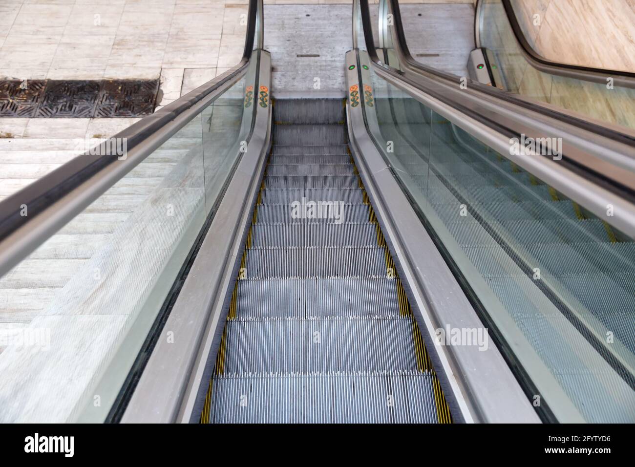 Escalator stairs to an underground subway station . Steps of the ...