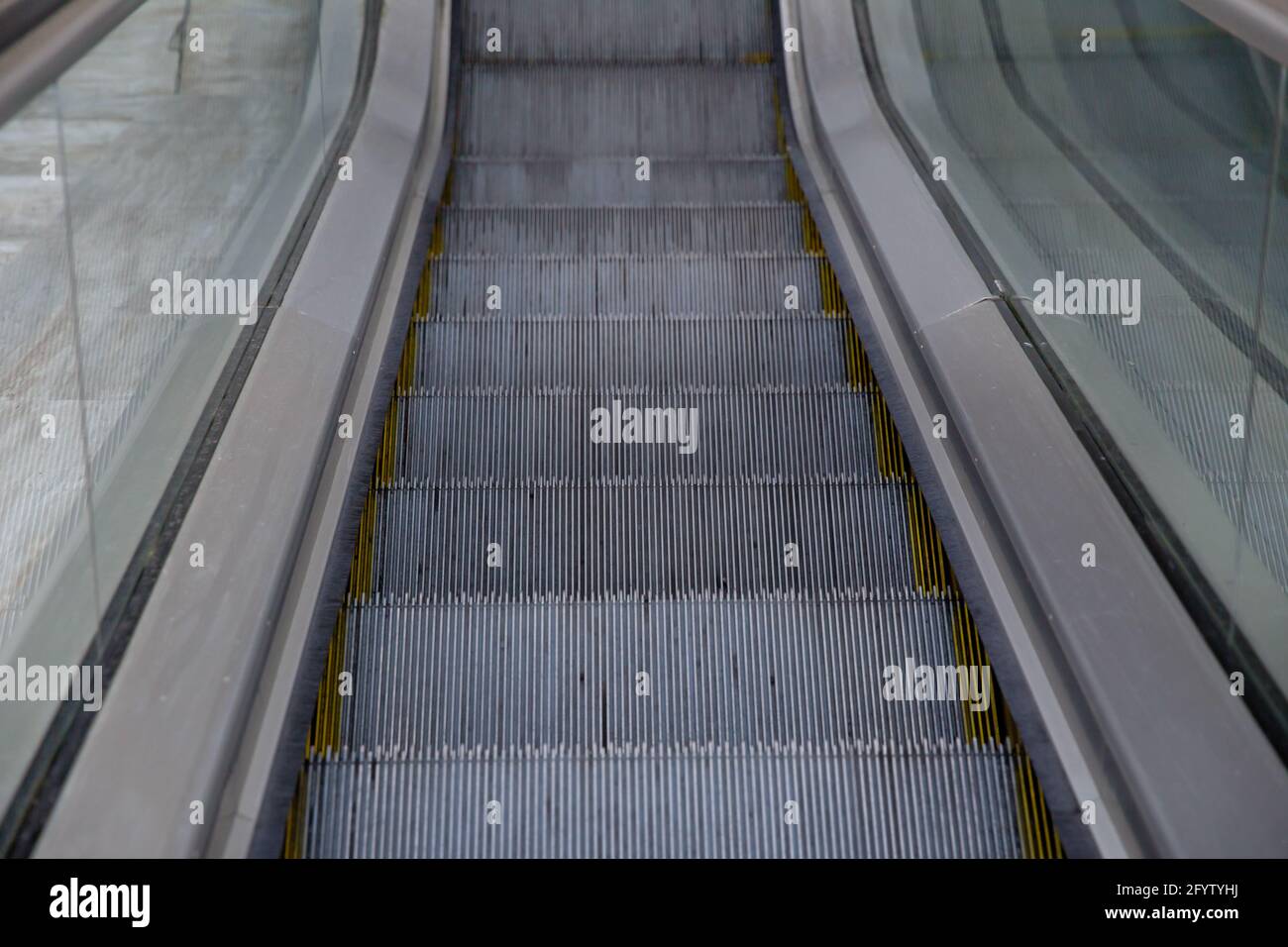 Escalator stairs to an underground subway station . Steps of the ...