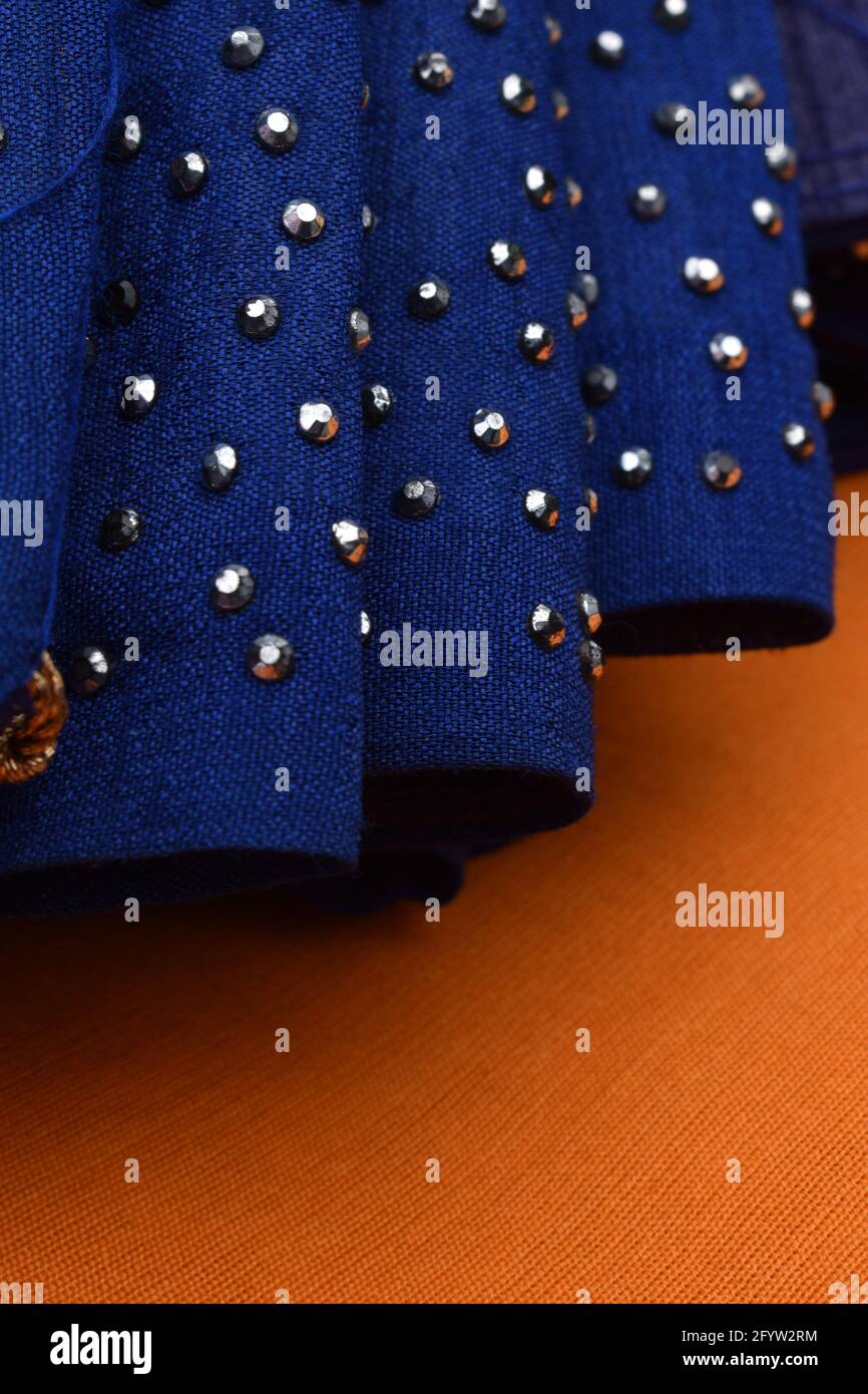 A piece of blue cloth decorated with silver shiny stones Stock Photo ...