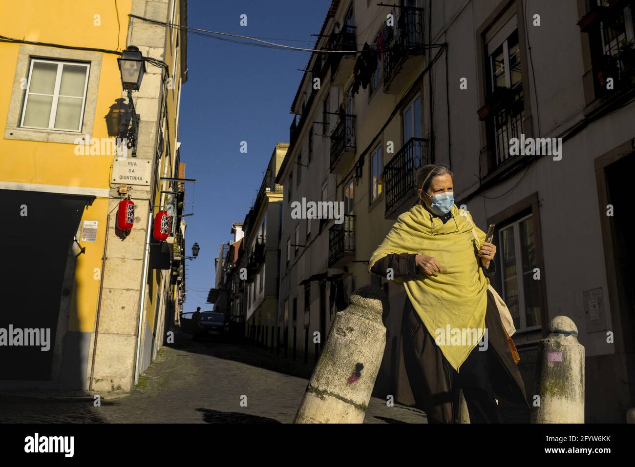 Woman passing by Stock Photo - Alamy