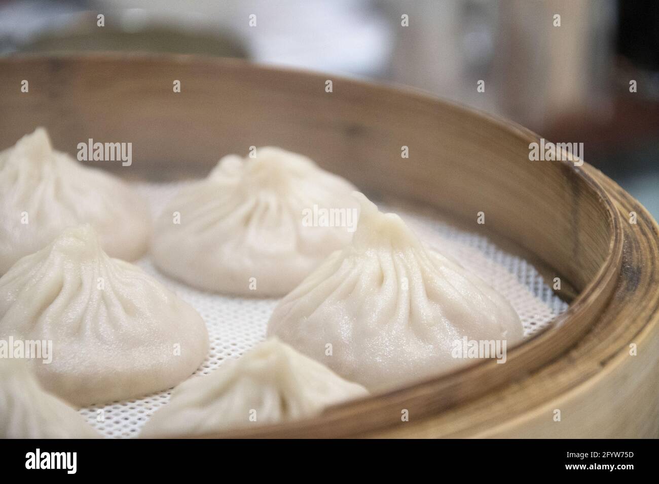 Xiao long bao or steamed pork and soup bun or dim sum.It is steamed ...