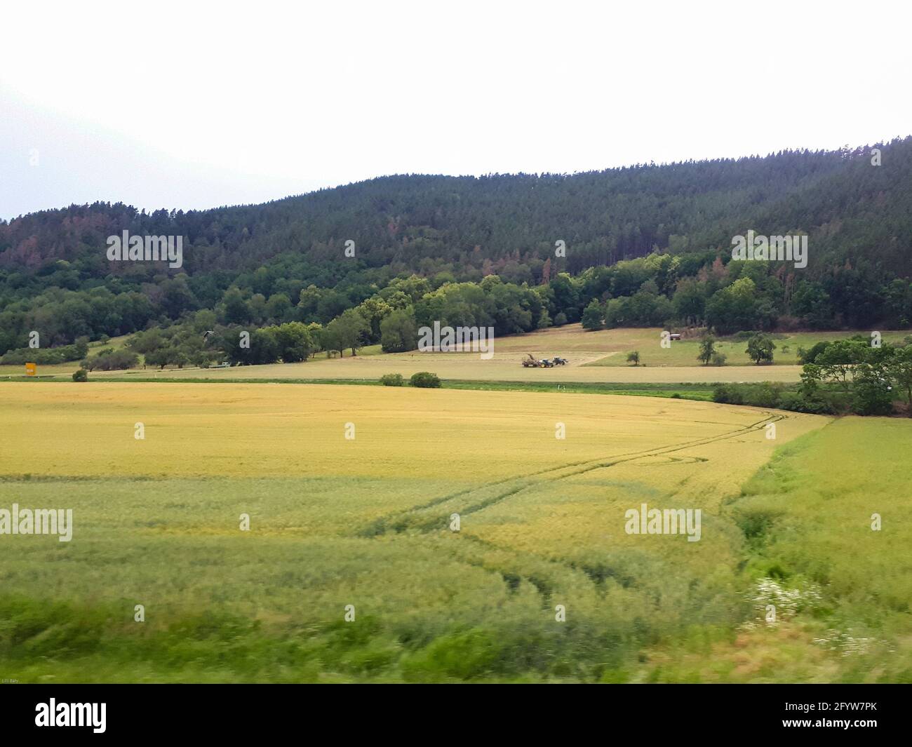 idyllic view on green countryside against sky in germany Stock Photo ...