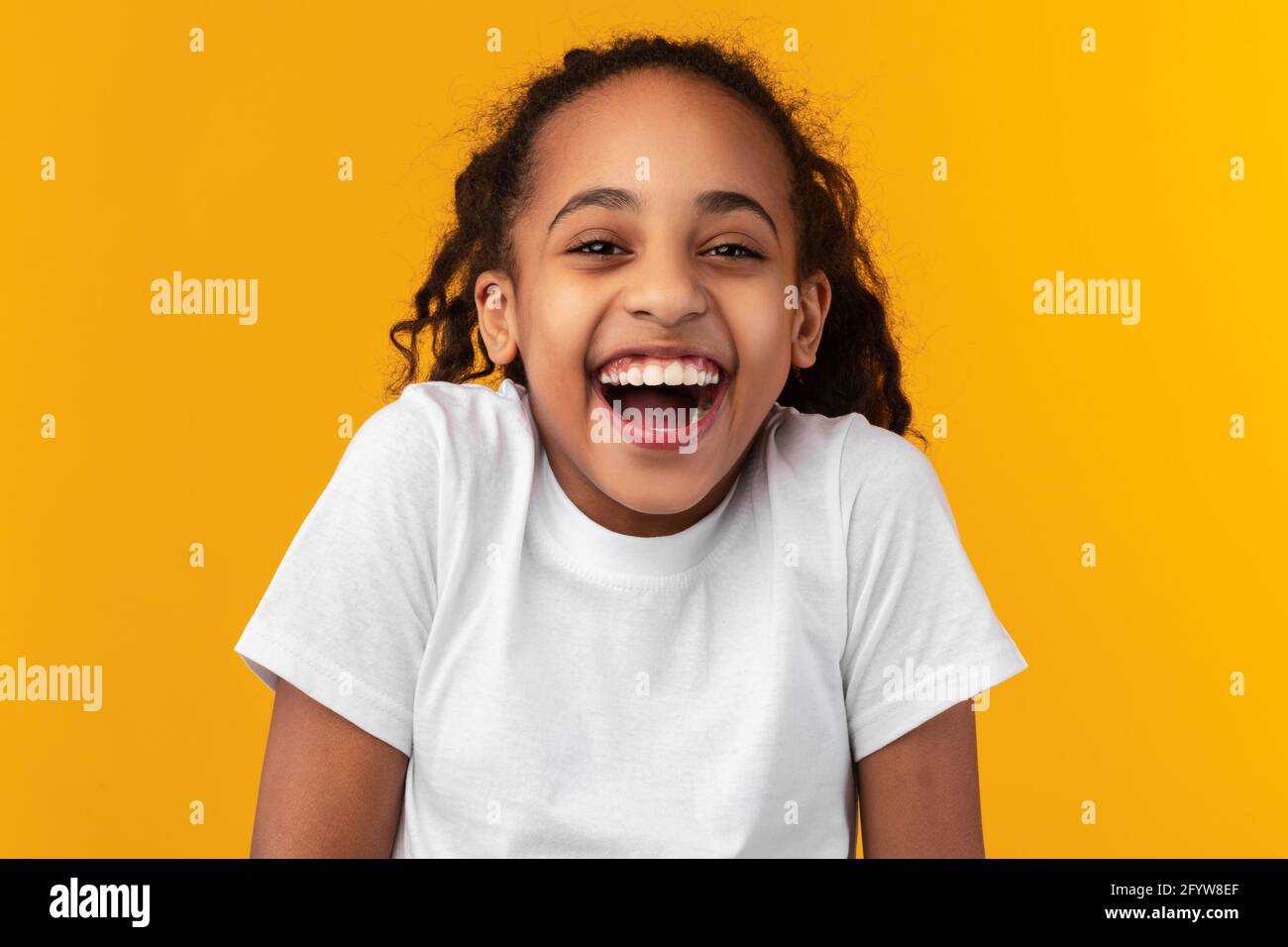 Positive African American Girl Laughing At Camera Stock Photo - Alamy